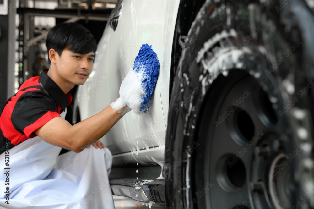 Man Worker use Soap Washing and Taking Care of Vehicle car body with ...