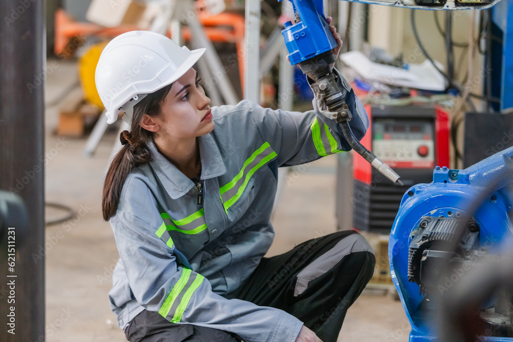 Engineers woman checking condition robotic arm. female technician ...