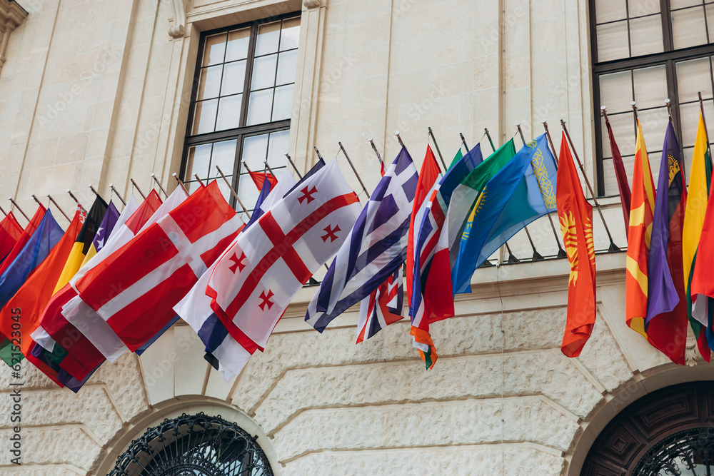 National flags of various countries flying in the wind. Colorful flags ...