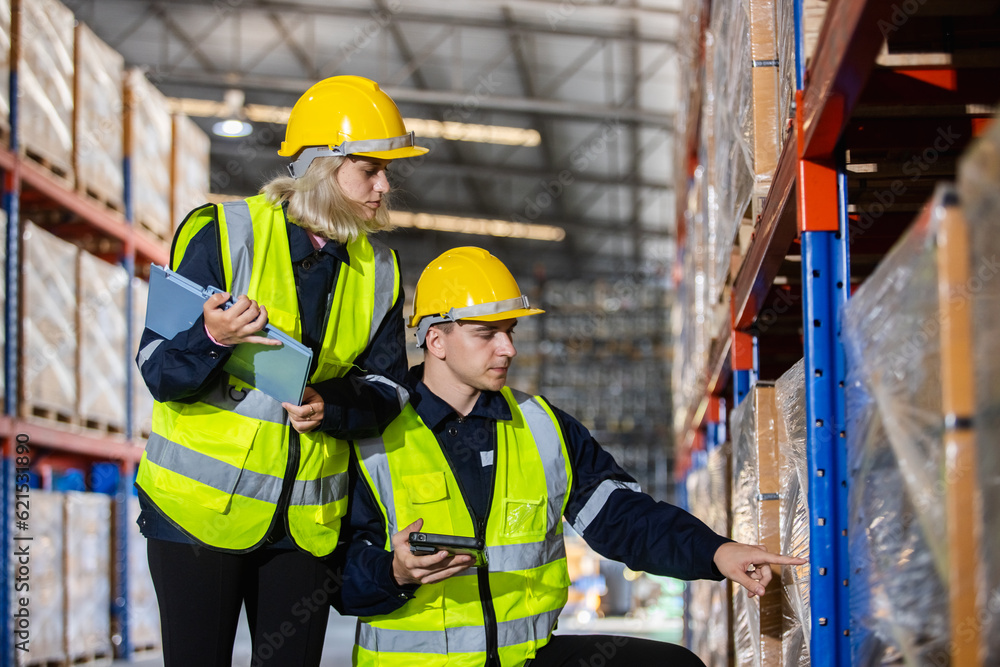 Male and Female professional worker wearing safety uniform and hard hat ...