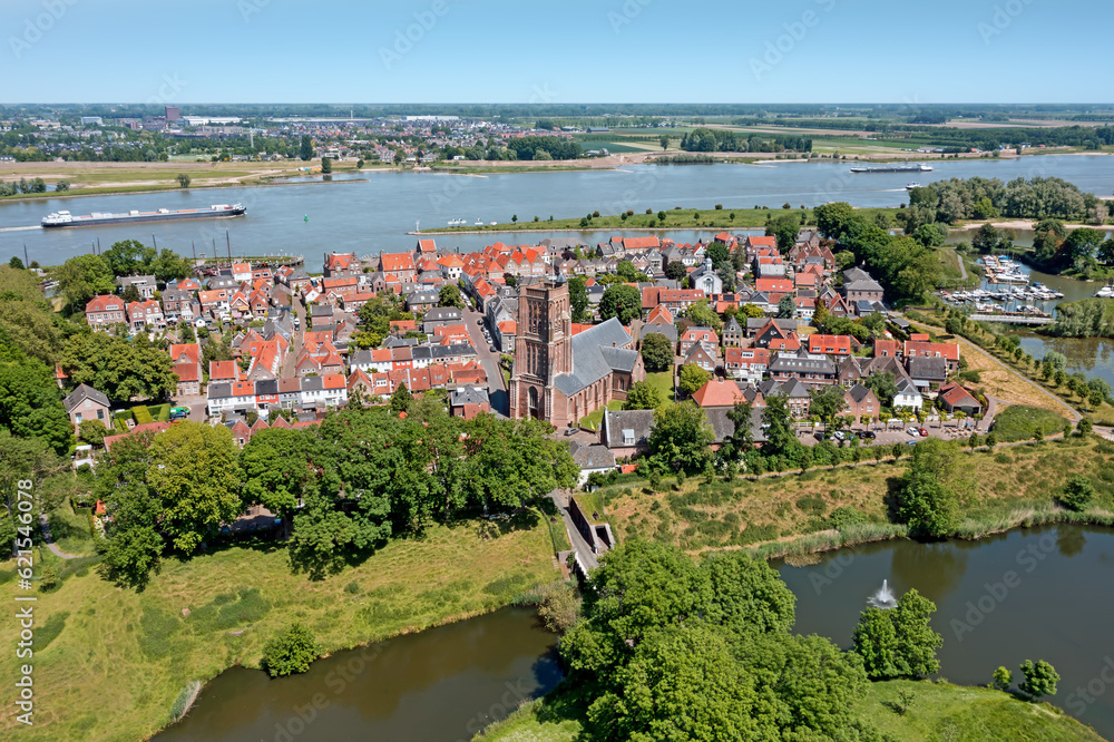 Aerial from the historical city Woudrichem at the river Merwede in the ...