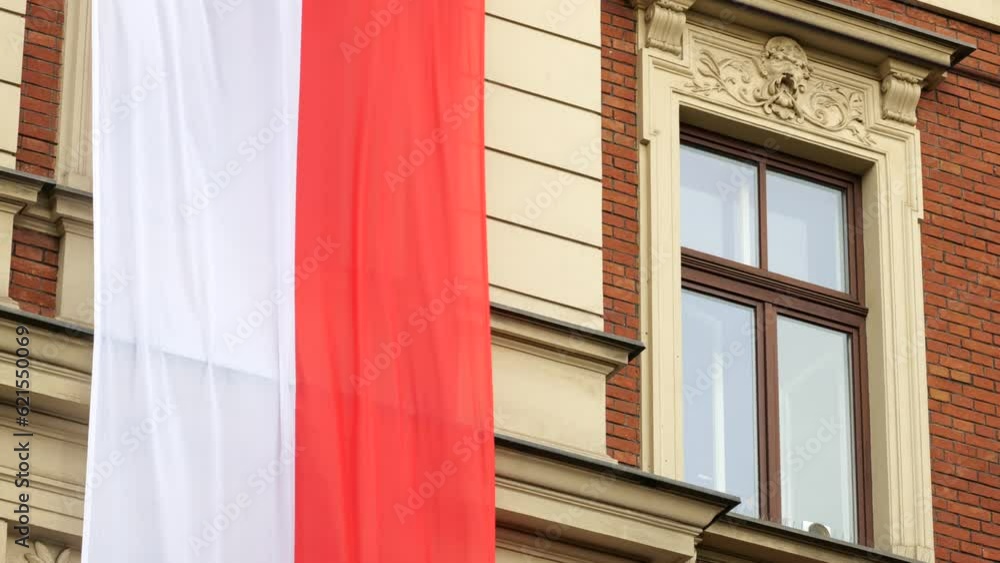 Large Polish flag hanging from the side of a building, Poland, Polish ...