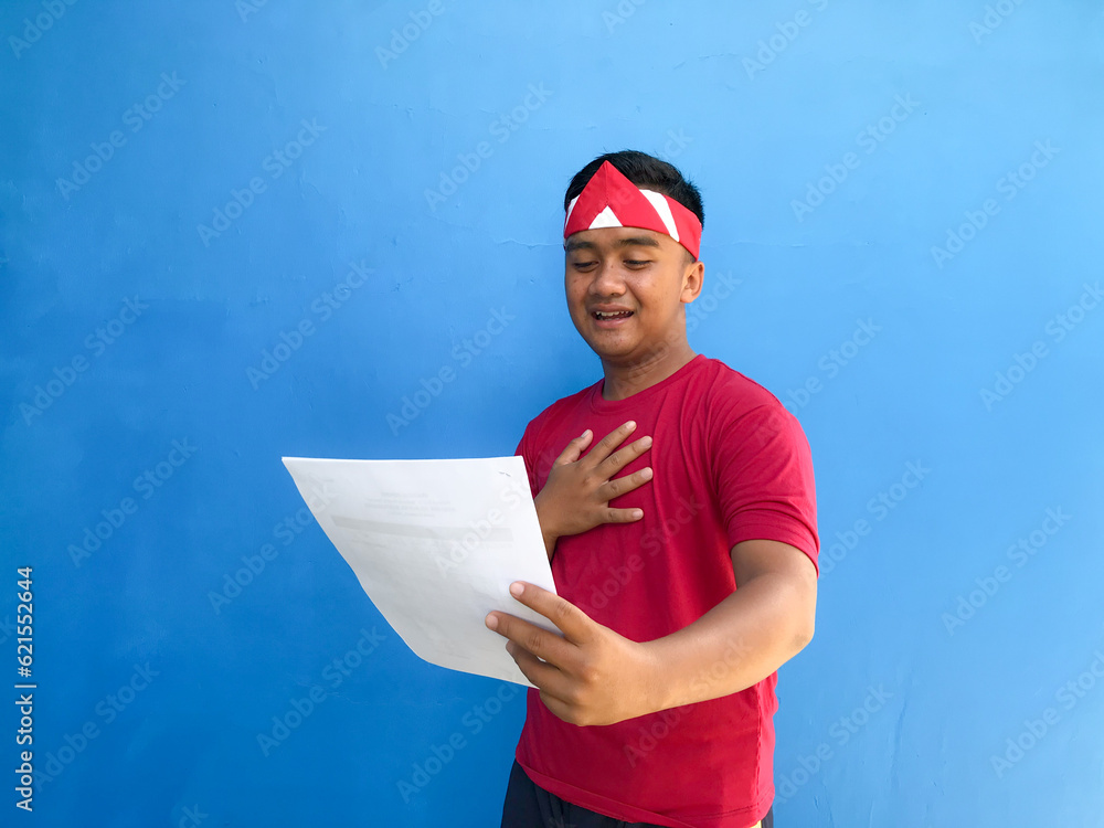 Beautiful Asian man giving salute celebrate Indonesian independence day ...