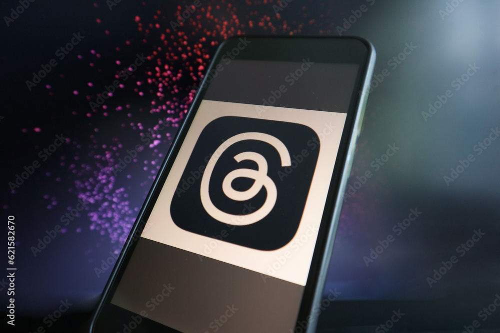 Threads logo is displayed on a smartphone screen. Threads is the new ...