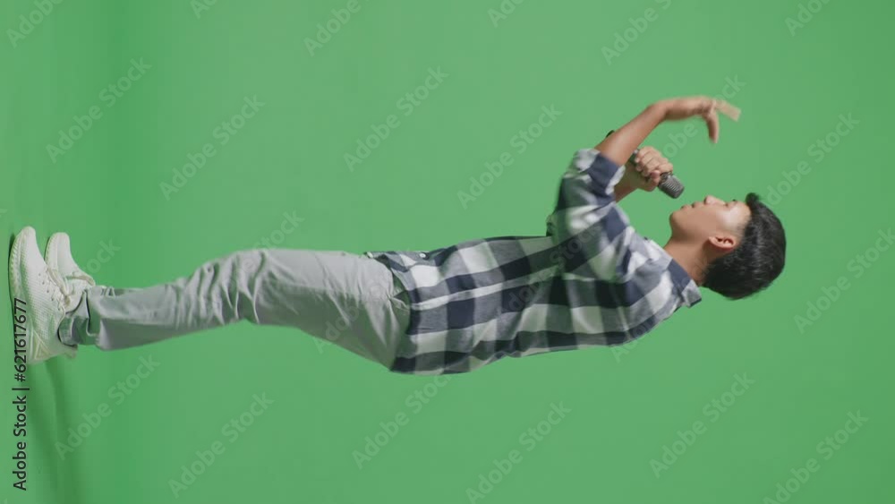 Full Body Side View Of Young Asian Teen Boy Holding A Microphone And ...