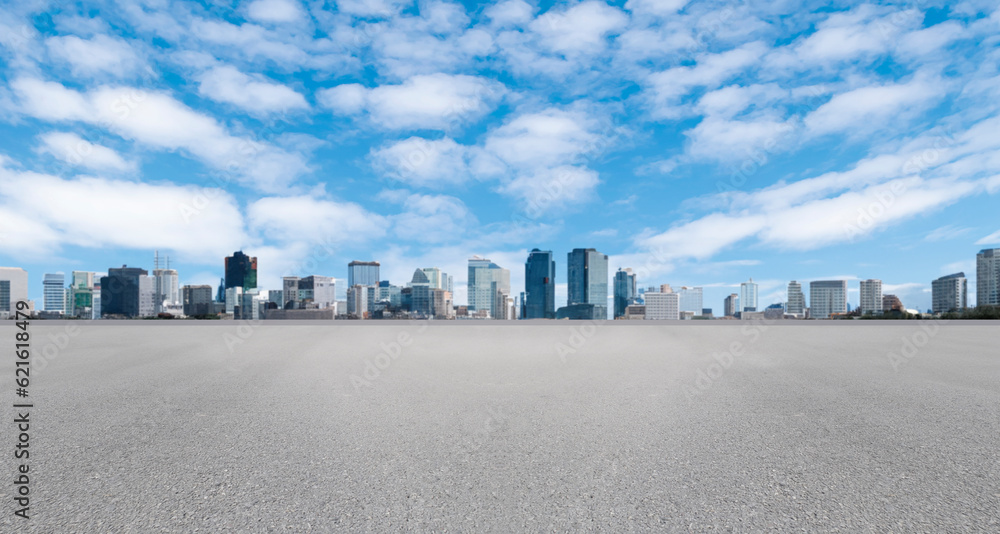 Empty wide asphalt road and city skyline. Side asphalt tarmac floor ...