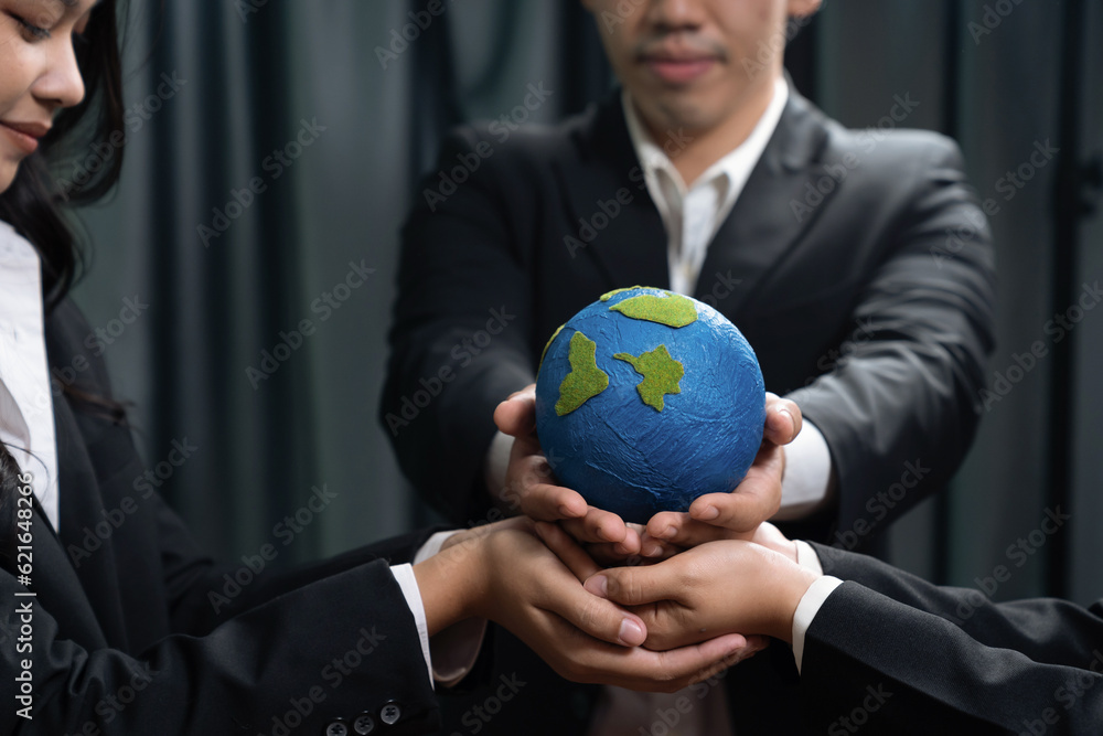 Top view business people holding Earth together in synergy as team ...