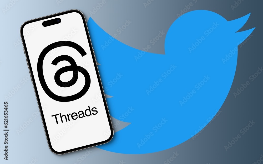 Threads logo displayed on a modern smartphone in front of the Twitter ...