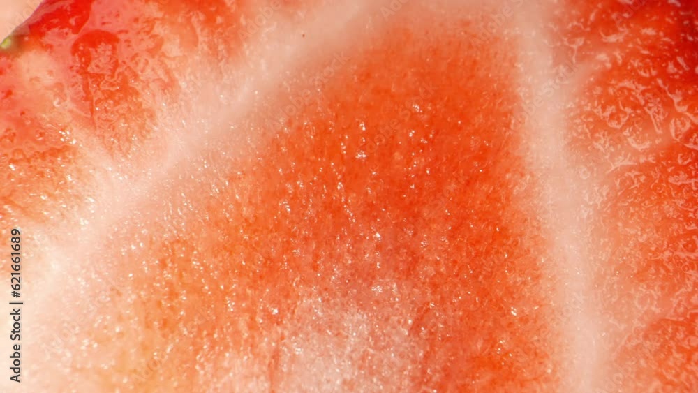 Captivating macro video showcases a half strawberry's exquisite details ...