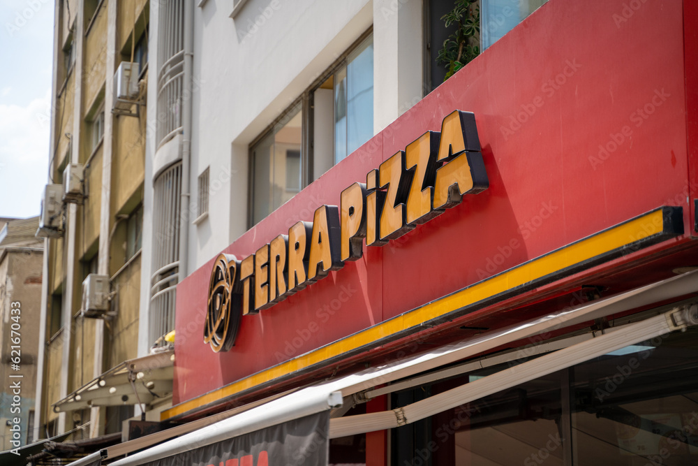 Terra Pizza sign and logo in Konak district. Terra Pizza Turkish restaurant chain. Izmir, Turkey ...