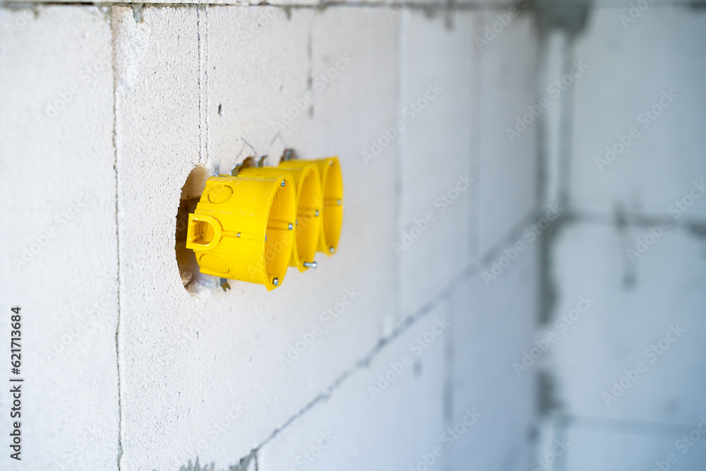 Yellow plastic recessed sockets, installation box for a socket in an ...