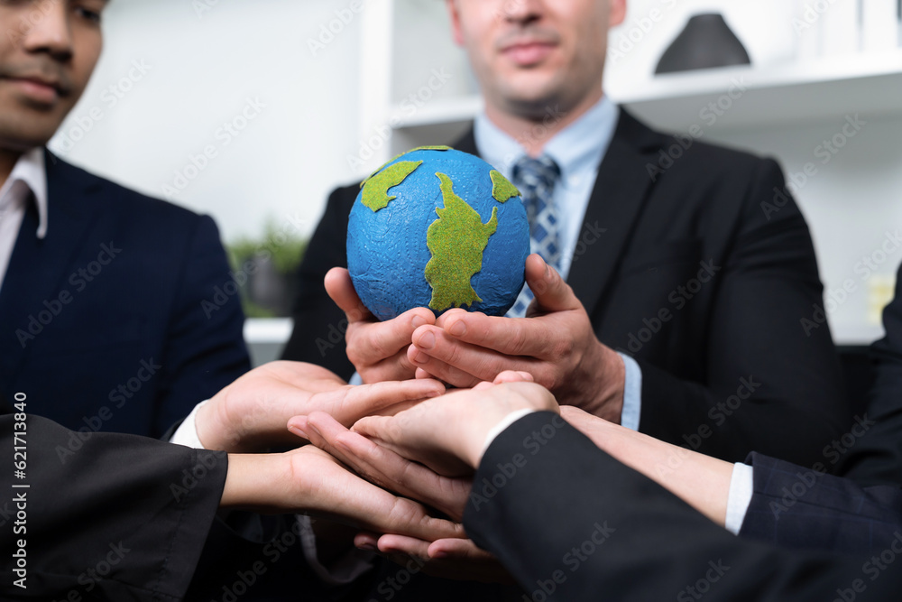 Foto de Top view business people holding Earth together in synergy as ...