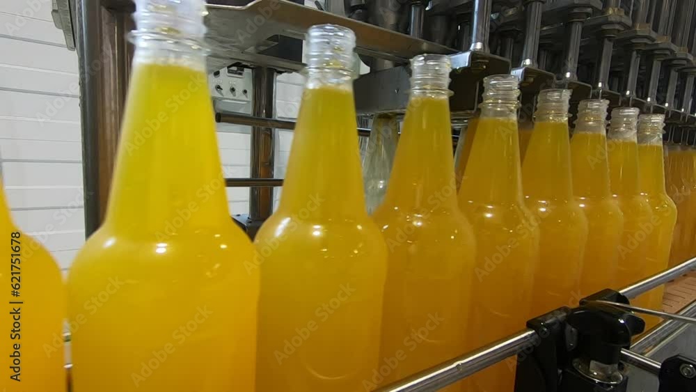 Bottling lemonade at the factory. Production of beverages - carbonated ...
