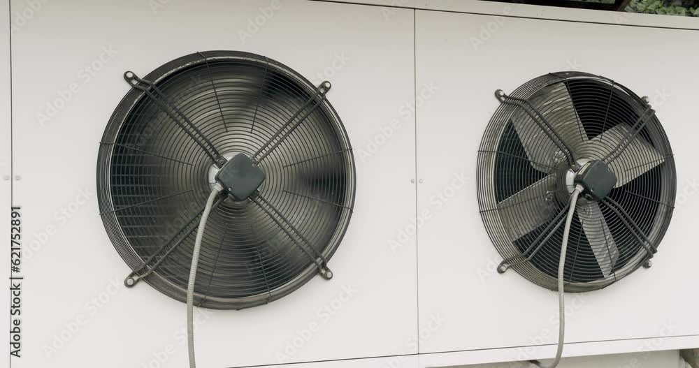 Industrial air conditioning system. Large fans on the wall of the ...
