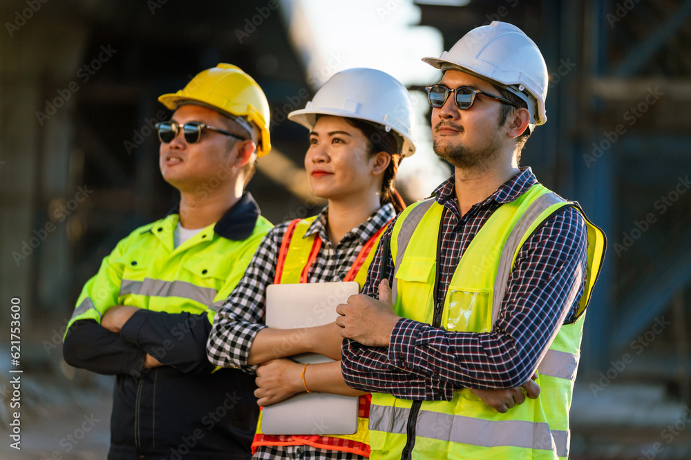 A team of architects, civil engineers, engineers, diversity standing ...