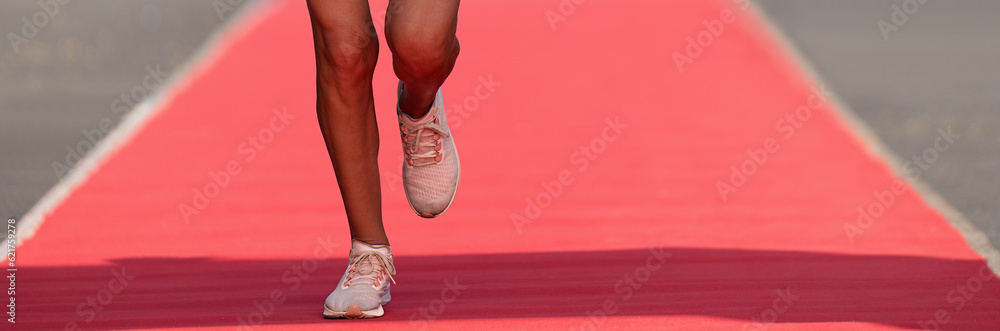 Woman running towards the finish line, female runner win the race ...