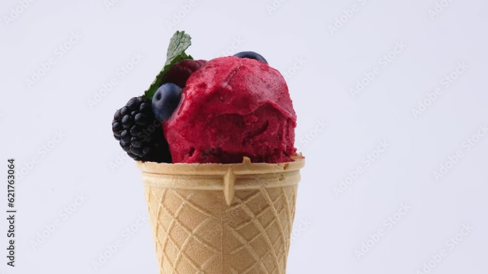 Ice cream cone with an assortment of fruits and ice cream flavors ...