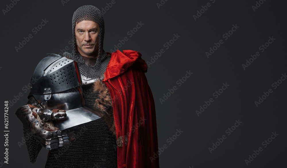 This portrait encaptures a medieval warrior in armor with a red cape ...