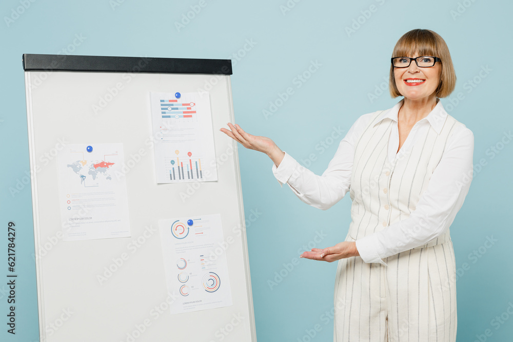 Blonde successful employee business woman 50s wear white classic suit ...