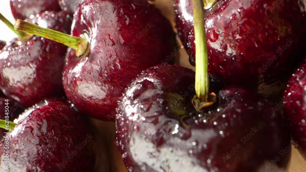 The macro video showcases the details of the cherries, revealing ...