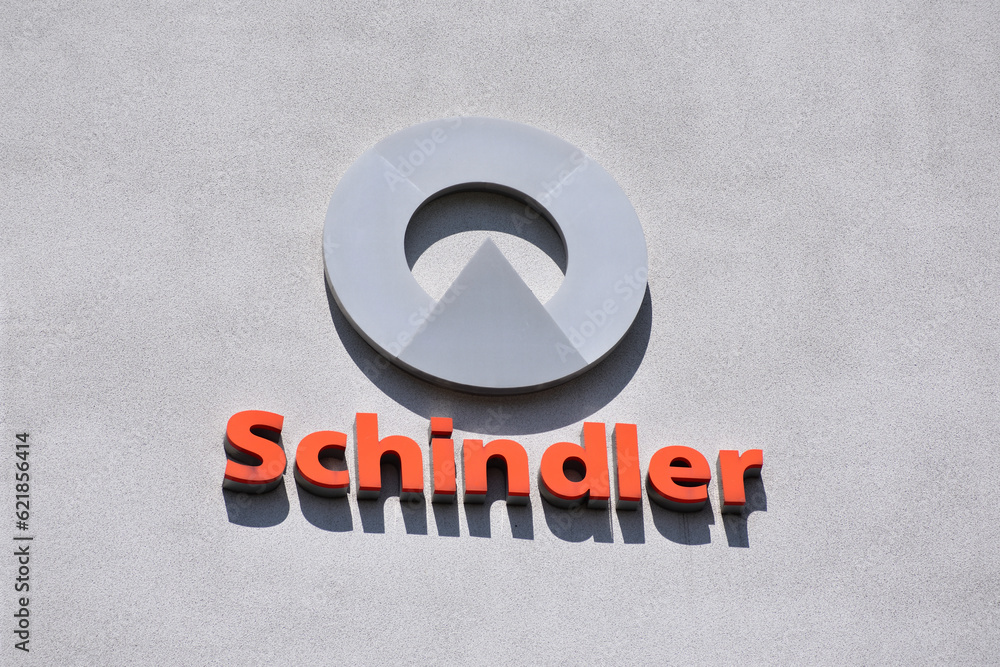Schindler Group signage, emblem, logo, sign on the facade. Elevator manufacturer company. WARSAW ...