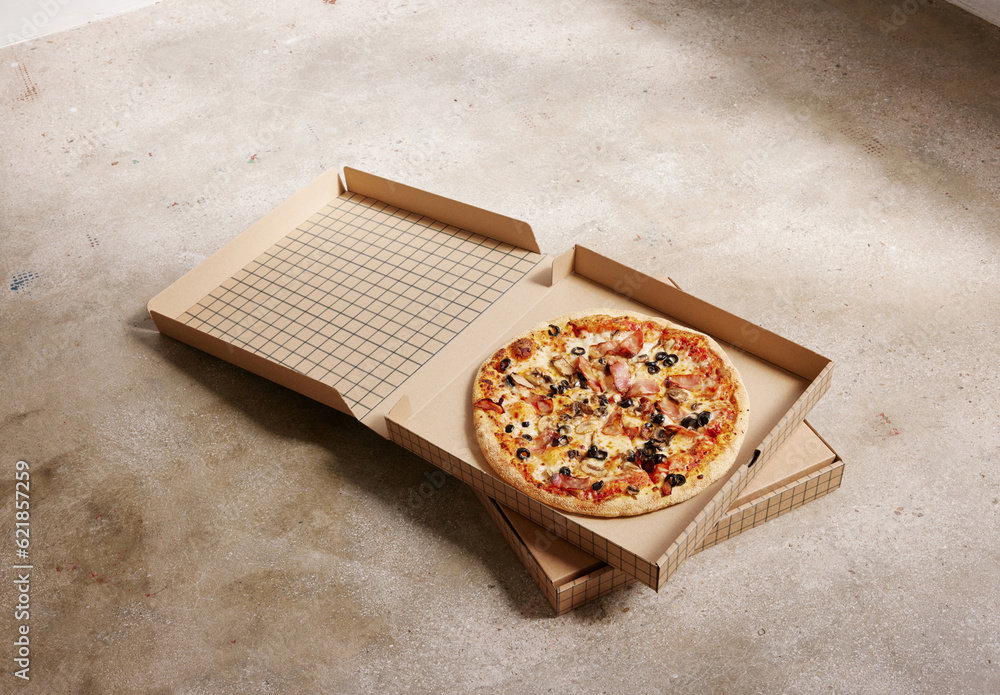 Mockup of customizable cardboard pizza box, open, on top of another box ...