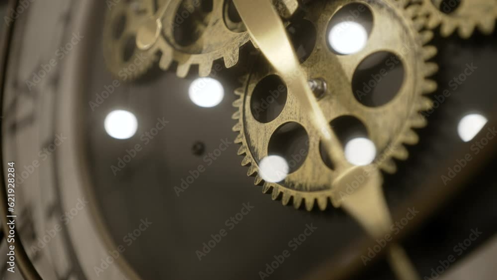 Clock gears and cogs in action. Wall clock with a mechanism, close-up ...