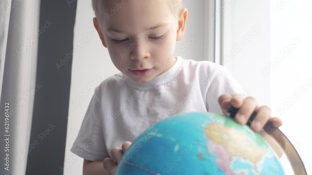boy studies globe. education travel tourism concept lifestyle. child ...