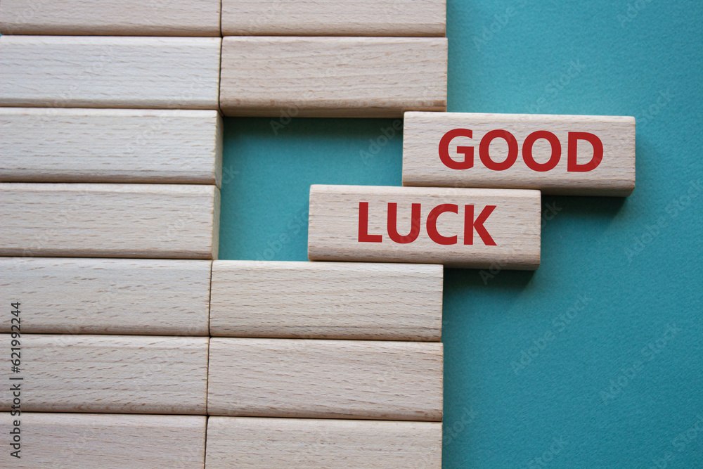 Good luck symbol. Wooden blocks with words Good luck. Beautiful grey ...