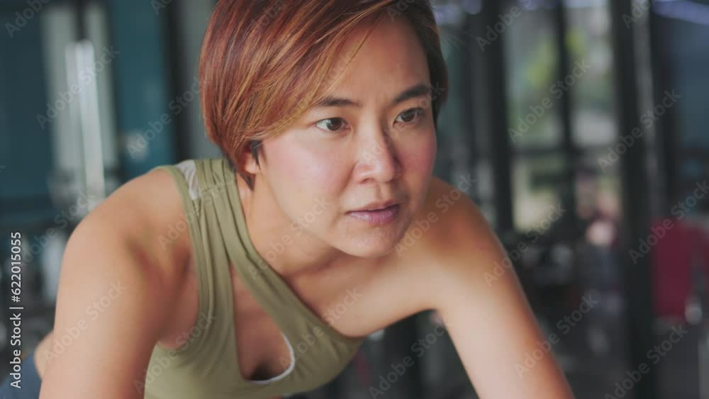 Muscle definition and determination of a short-haired beautiful Asian ...