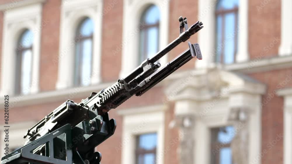 Vehicle mounted heavy machine gun pointing upwards, military vehicle in ...