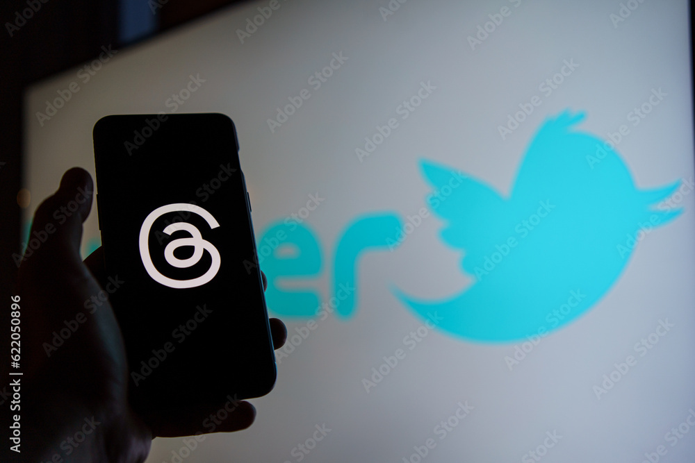 Threads logo on screen, Twitter logo in the background Stock Photo ...