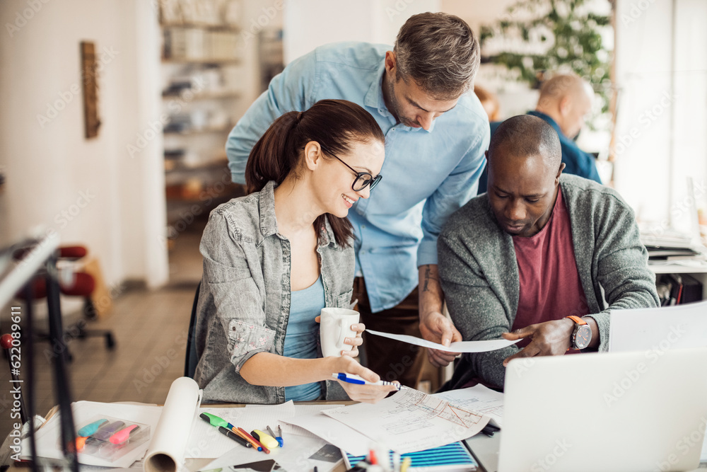 Group of people working together on a project in a startup company ...