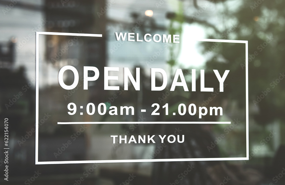A sign informing customers of cafes on holidays. Open sign on the glass ...