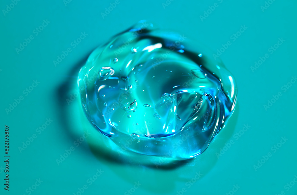 Transparent gel drop. Liquid cream gel cosmetic smudge texture on blue ...