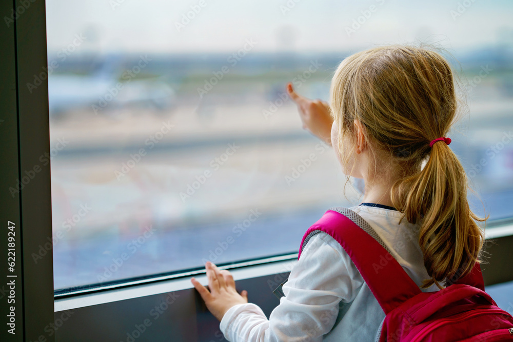 Little Girl at the Airport Waiting for Boarding at the Big Window. Cute ...