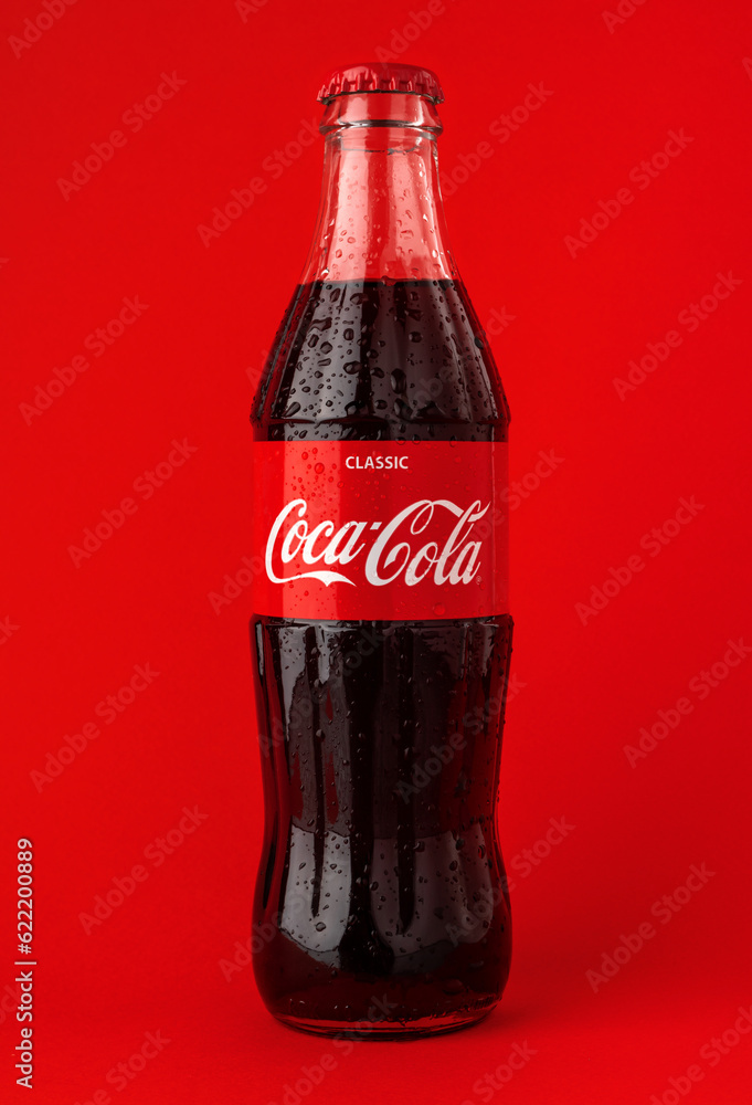 Batumi, Georgia - July 10, 2023: Glass bottle of icy Coca Cola on a red ...