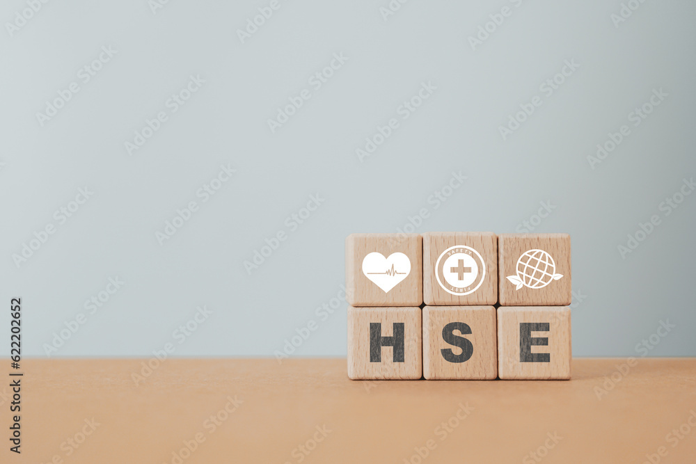 HSE text on wooden cube blocks. For environmental management, health ...