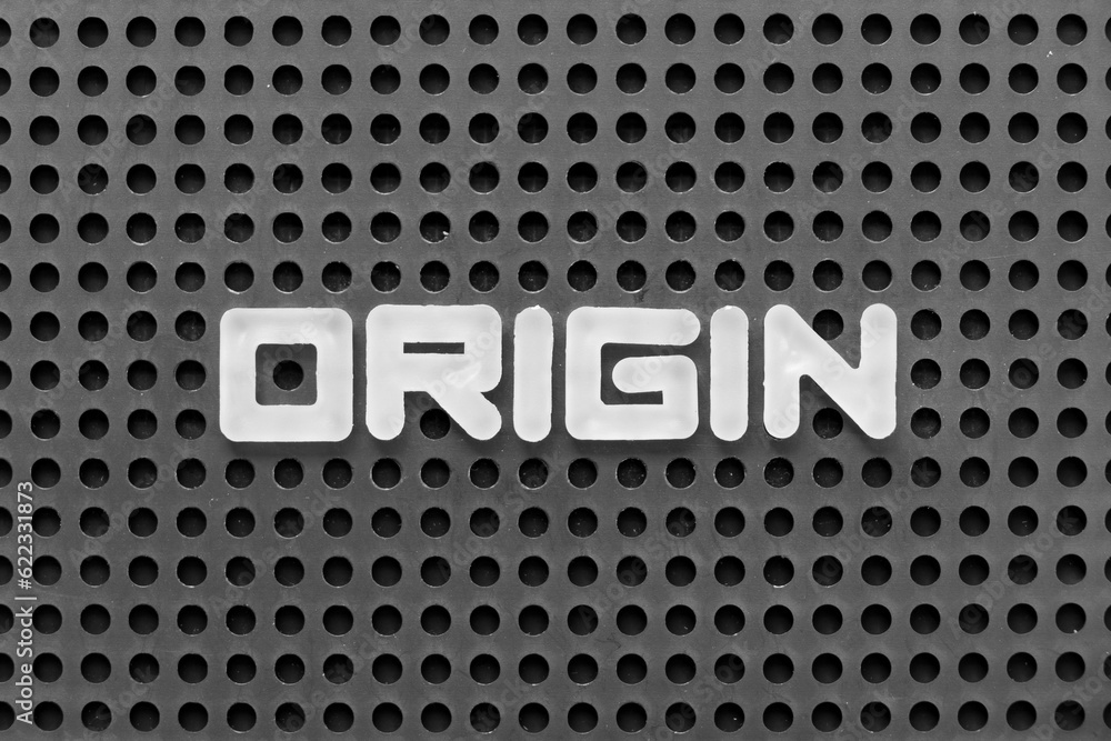 White Alphabet Letter In Word Origin On Black Pegboard Background Stock white-alphabet-letter-in-word-origin-on-black-pegboard-background-stock