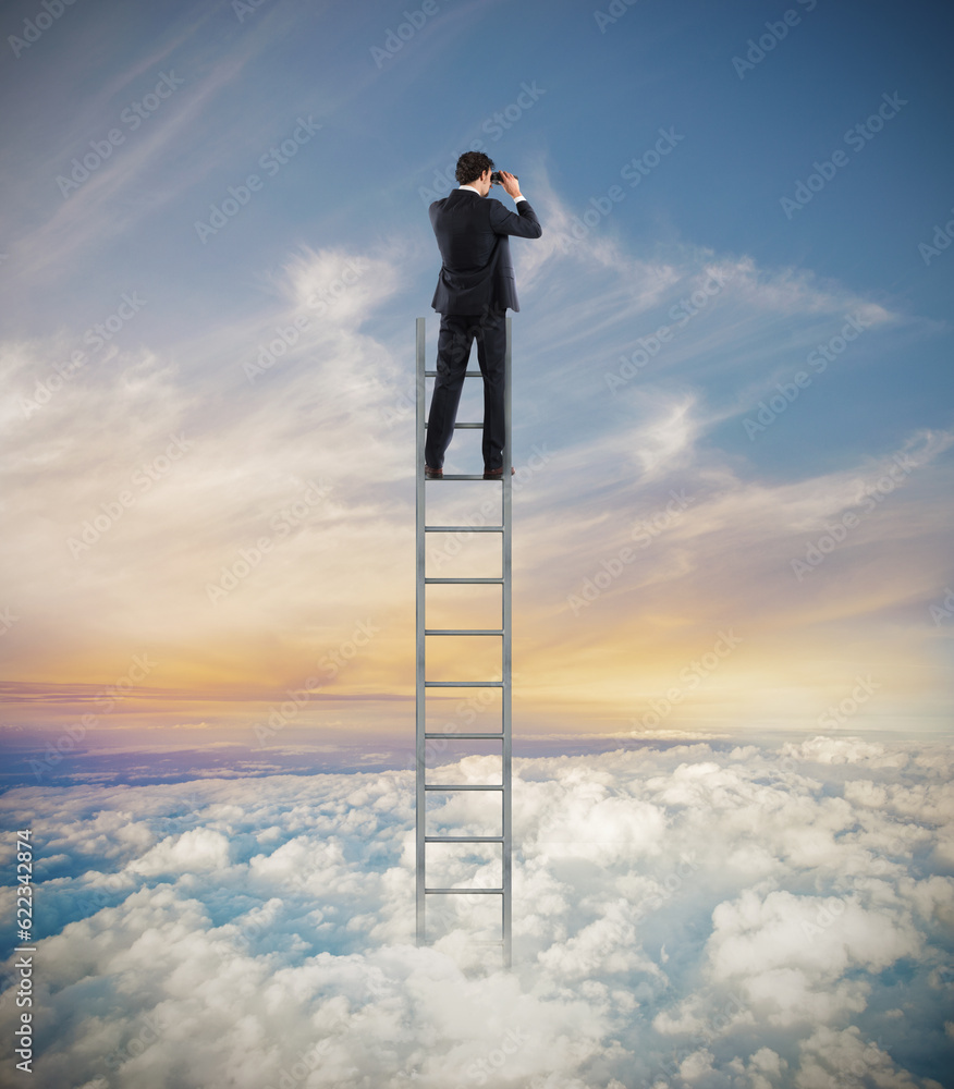 Man on a ladder high into the sky watching with binoculars Stock Photo ...