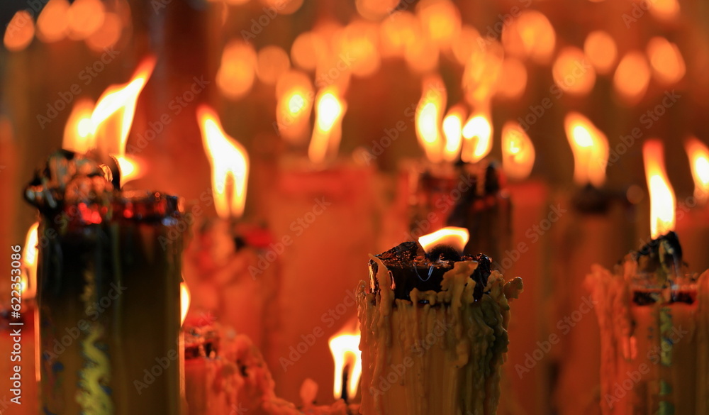 yellow wax chinese candles with lucky symbol burning red Chinese candle ...