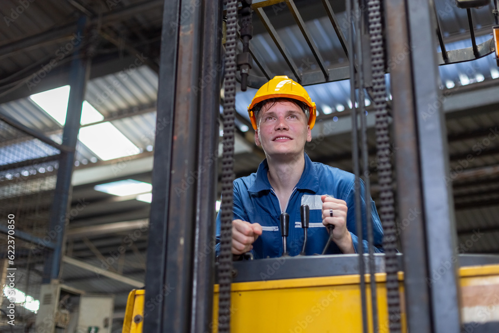 Man wear safety helmet driver forklift warehouse in factory. Male ...