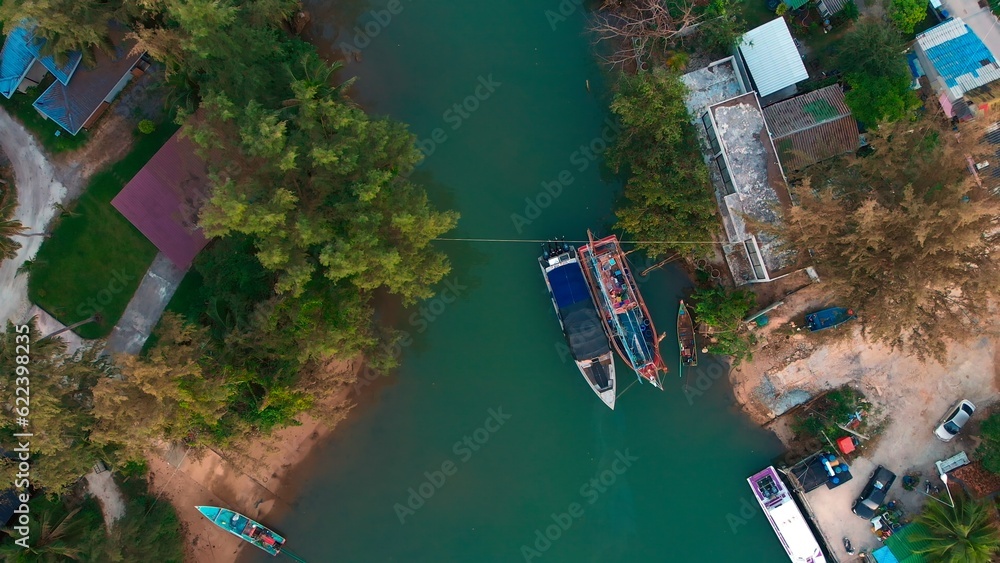 Aerial top view houses above water, fishing boats Ecuador harbor ...