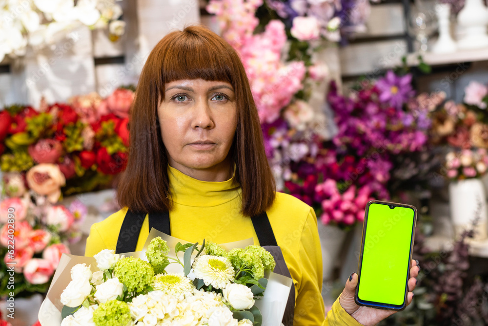 Floristry. Flowers. A florist girl with a bouquet of flowers, and with ...