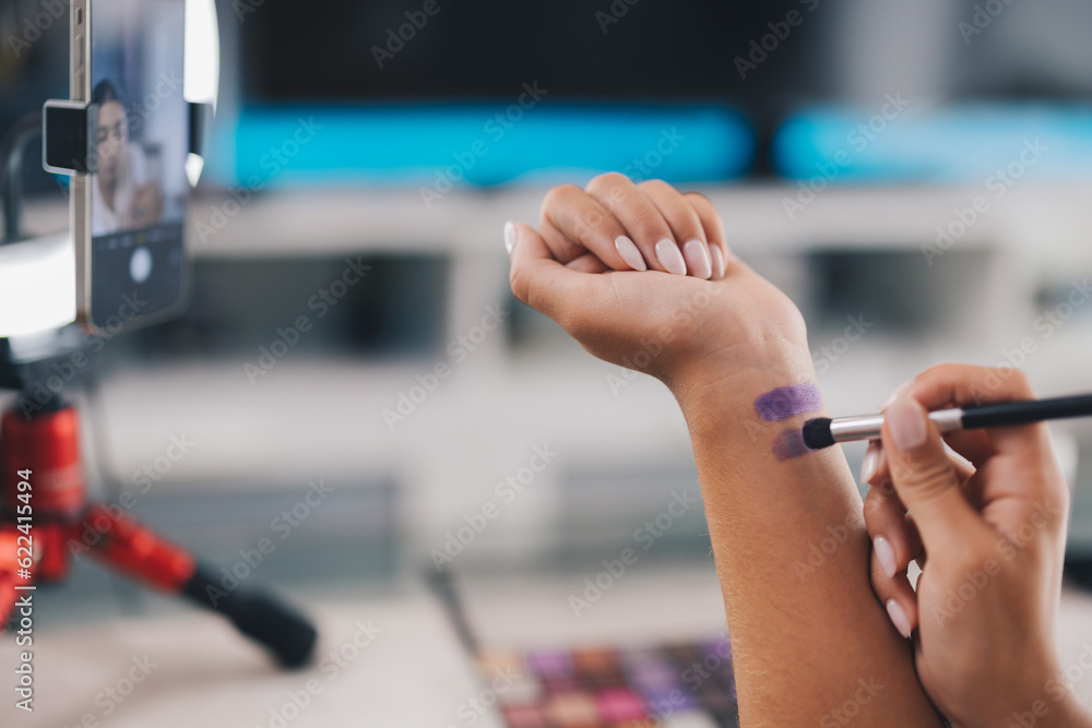 unrecognized woman influencer applying makeup at home. woman vlogger ...