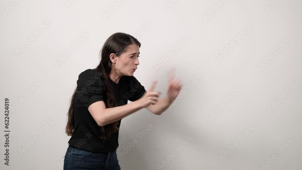 Woman in black shirt scolding her son for something he did, woman upset ...