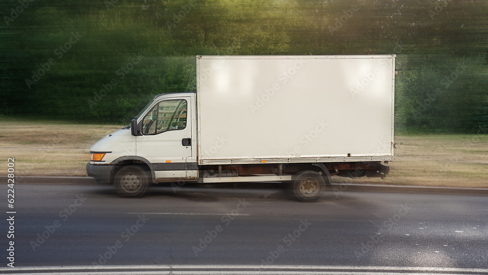 Small cargo truck with empty white side for mock up moving fast on ...