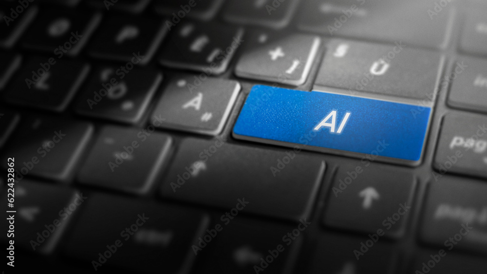 AI key on laptop computer keyboard, blue button on the dark grey ...