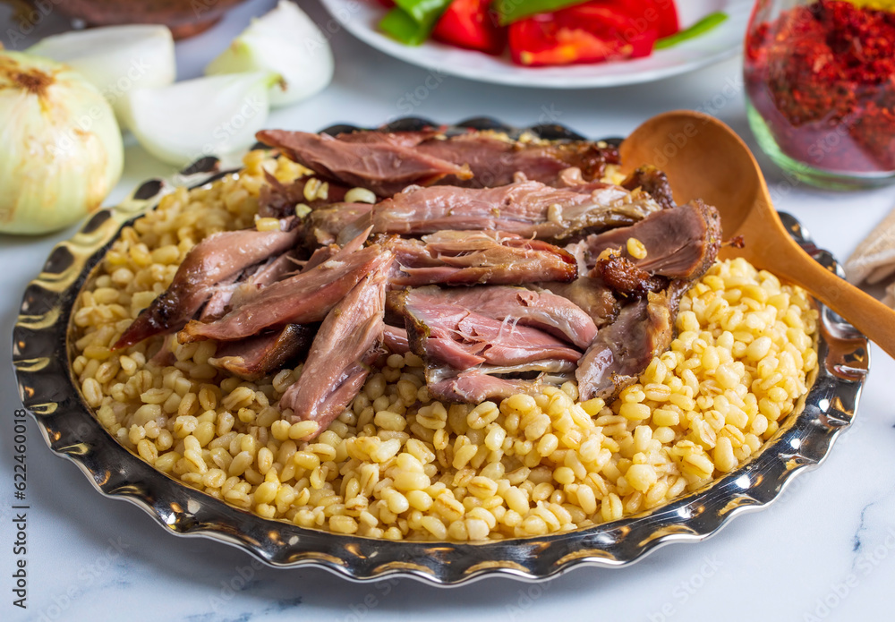 Turkish foods; lamb shank tandoori on bulgur wheat rice (Turkish name ...