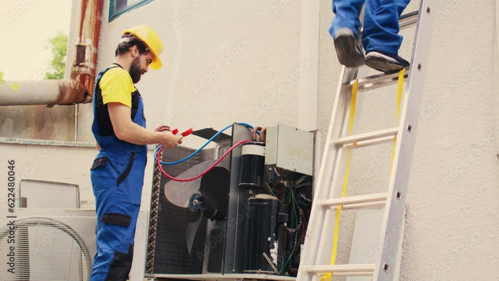 Proficient expert holding electric power drill stepping down from ...